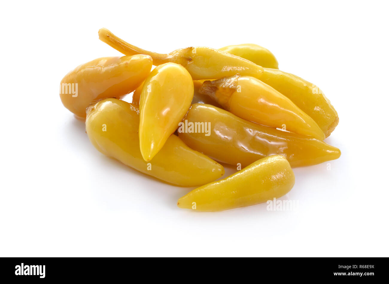 Pickled or marinaded Capsicum annuum pepper isolated on white ...