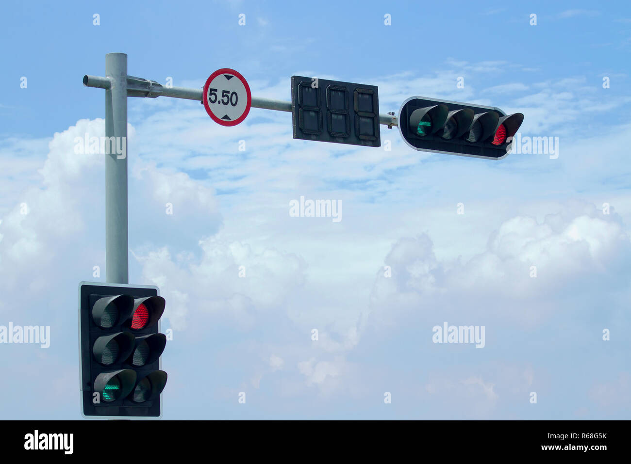 Traffic light and signboard limit of height on blue sky background ...