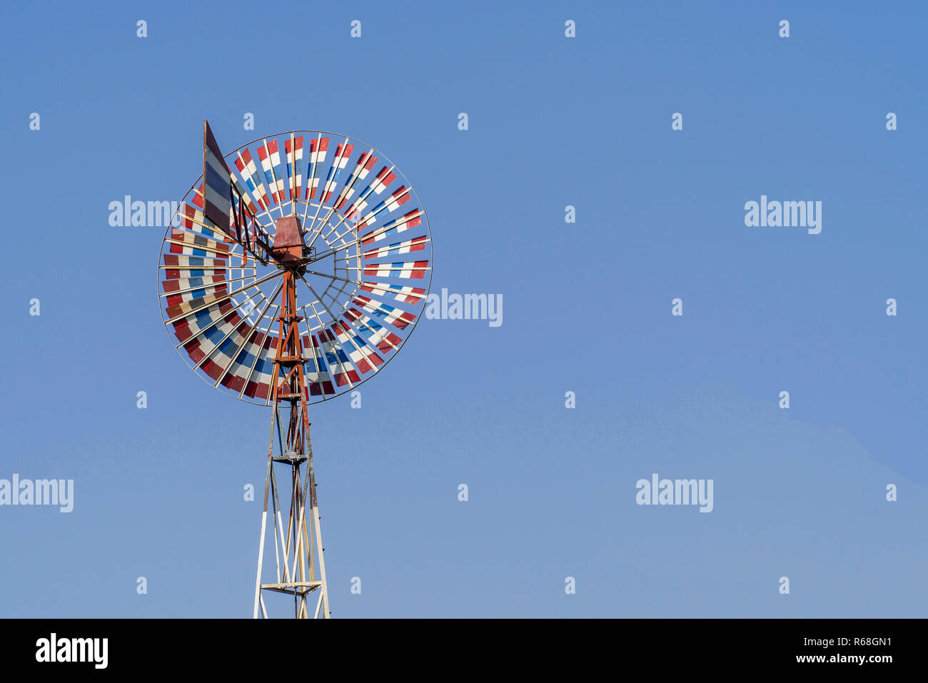 Wind turbine of red, white, blue color and old with blue sky Stock ...