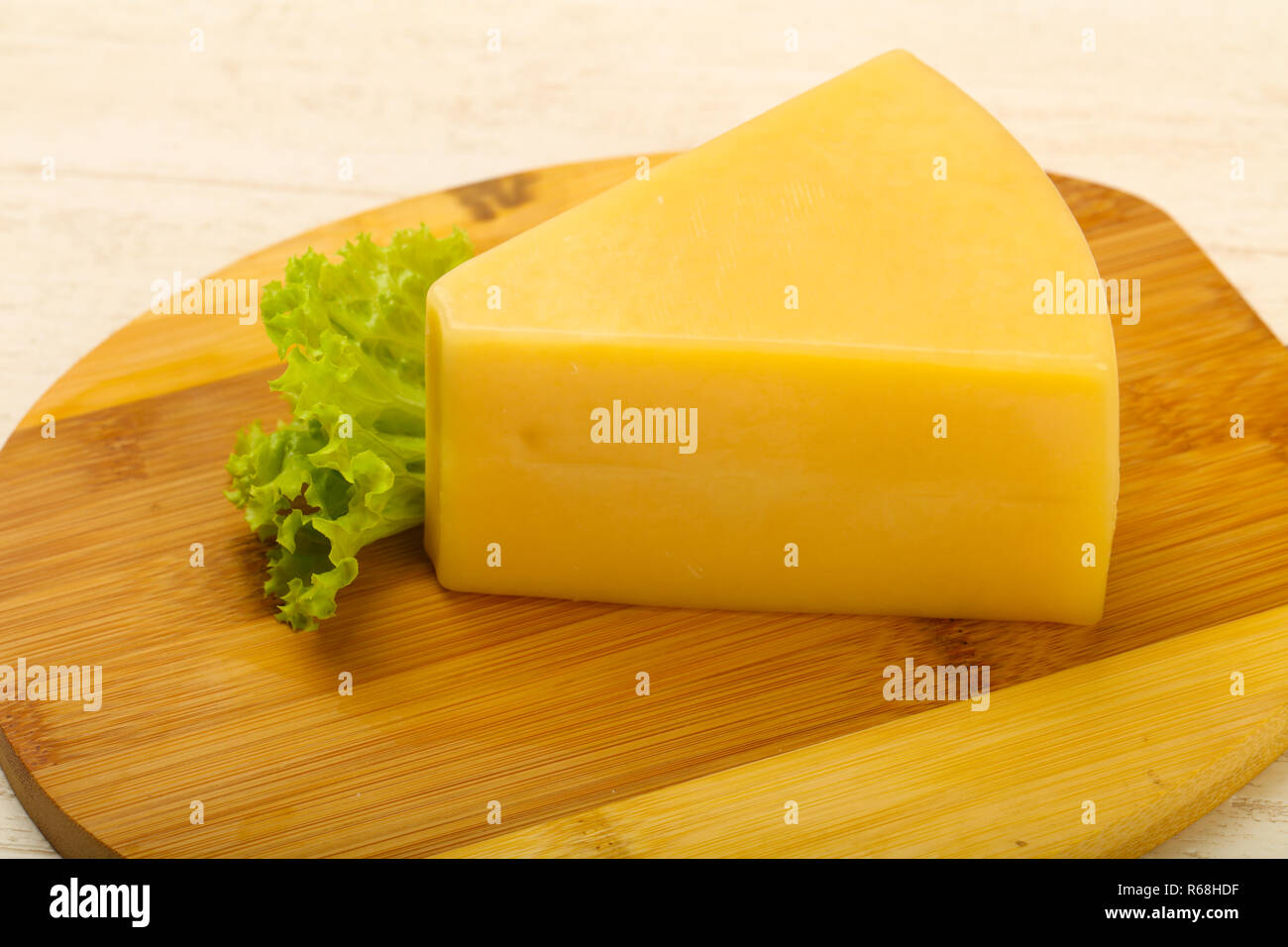 Parmesan cheese triangle Stock Photo - Alamy