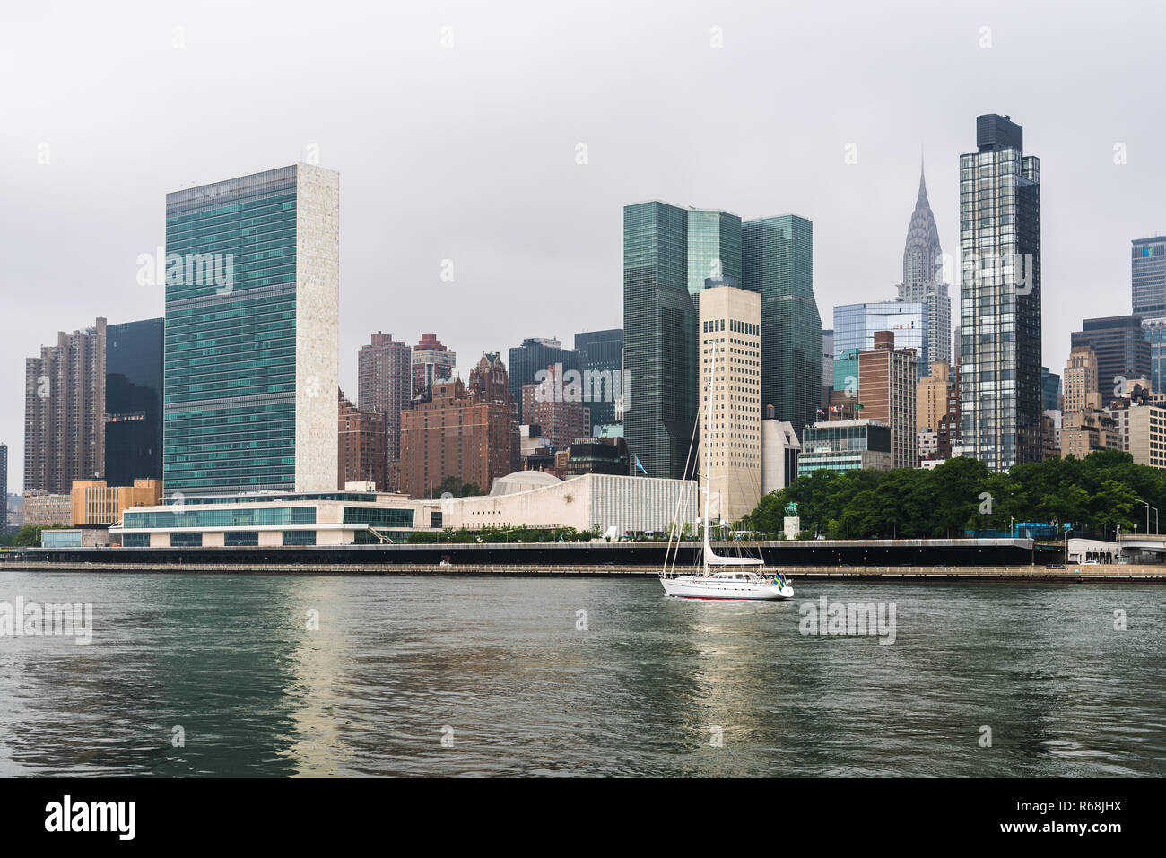 Sailing ship on East River against skyline of Midtown of New York City a misty day Stock Photo ...