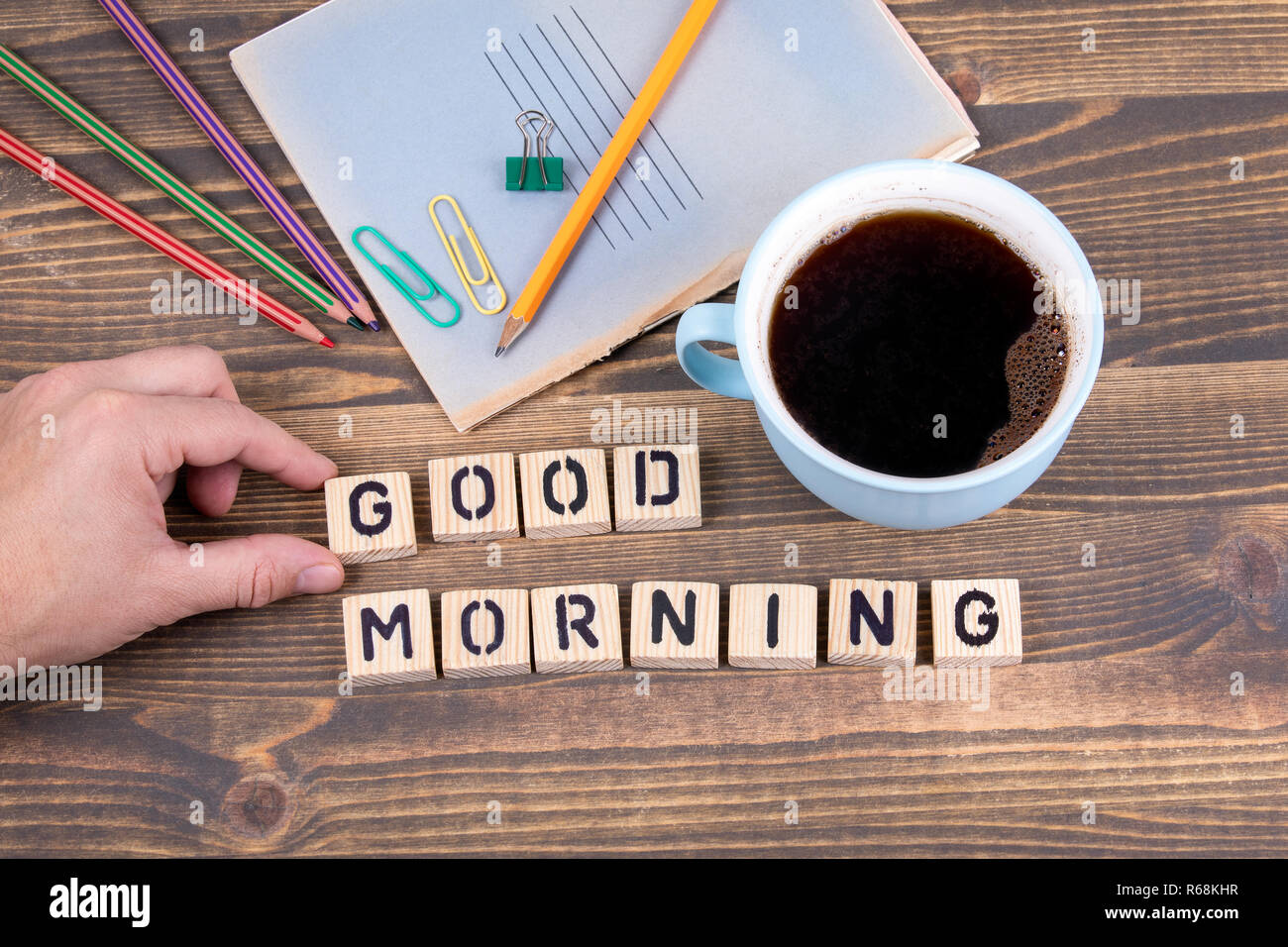 Good Morning. Wooden letters on the office desk, informative and ...
