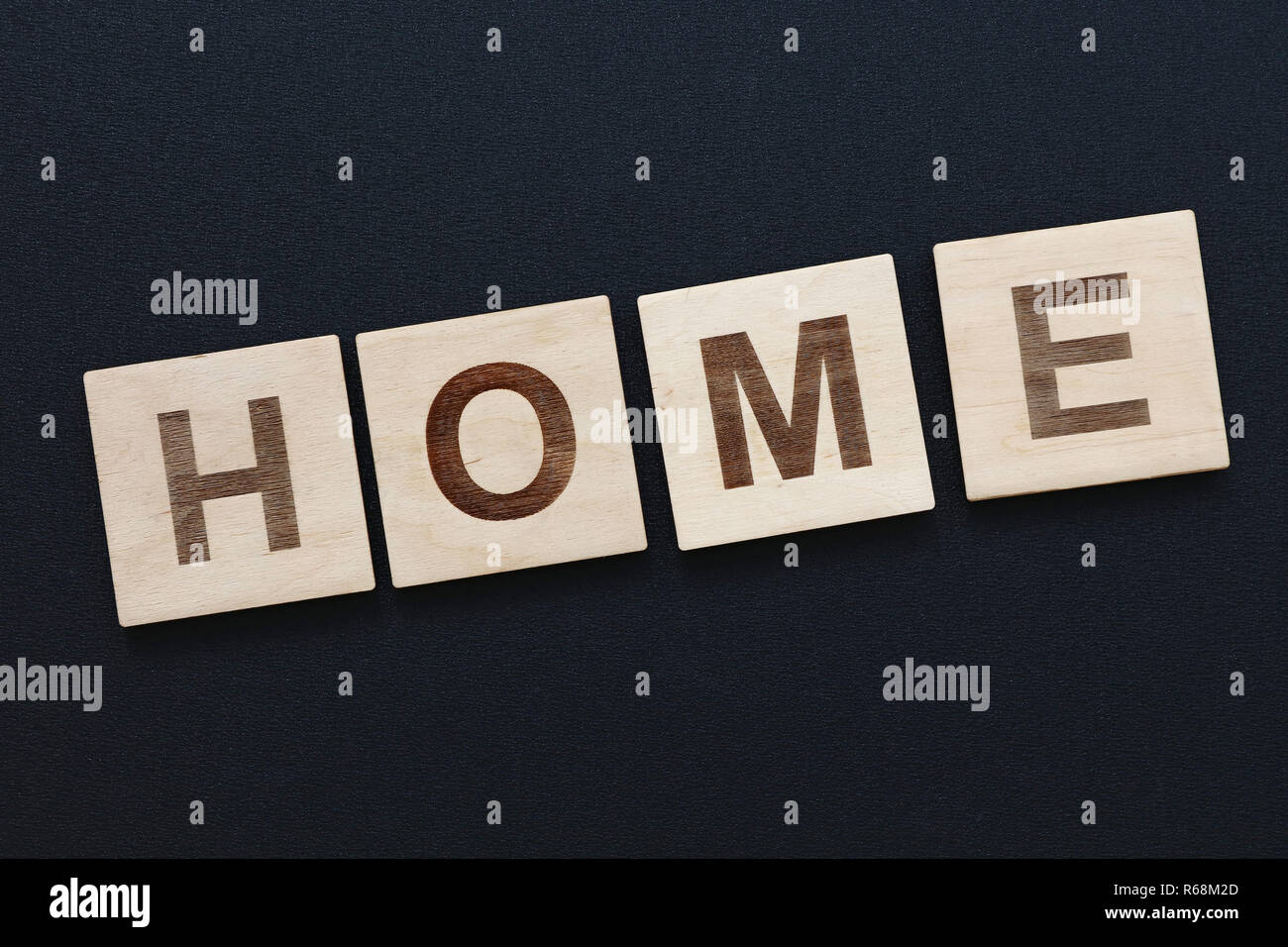 Word HOME on wooden signs over black Stock Photo - Alamy