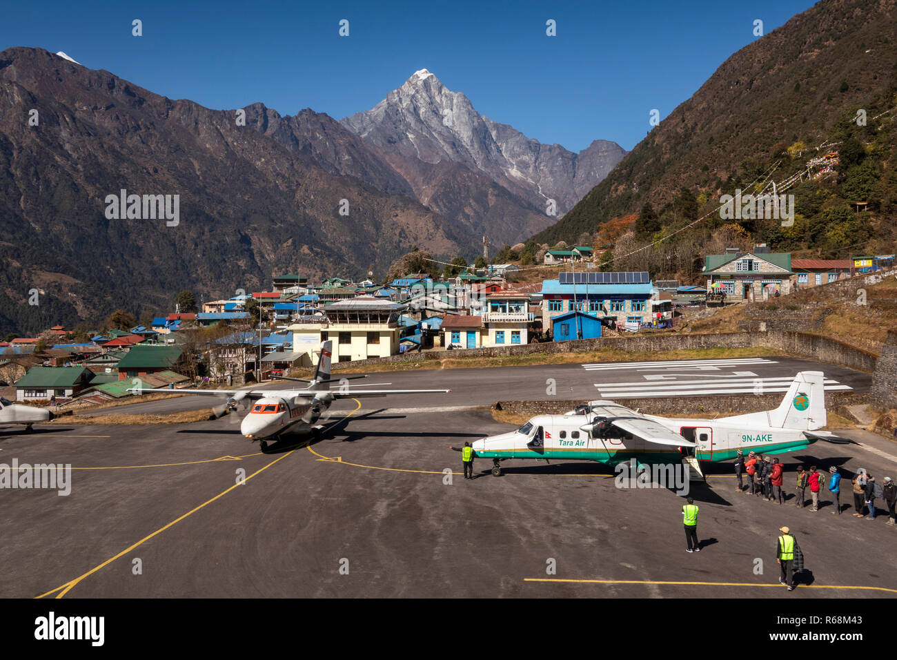 Nepal, Lukla, airport, passengers boarding Tara Air Dornier 228-212 ...