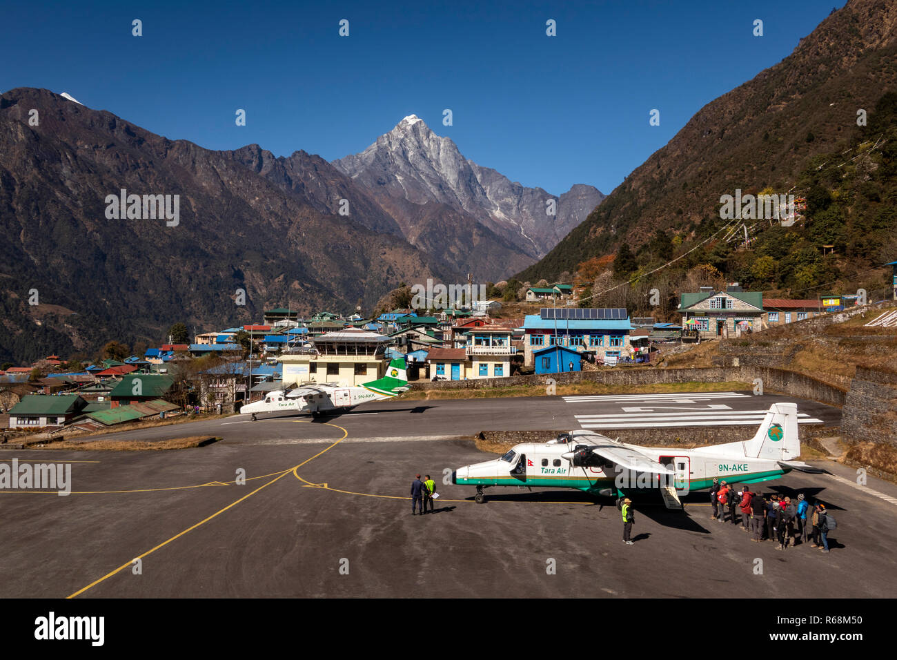 Nepal, Lukla, airport, passengers boarding Tara Air Dornier 228-212 ...