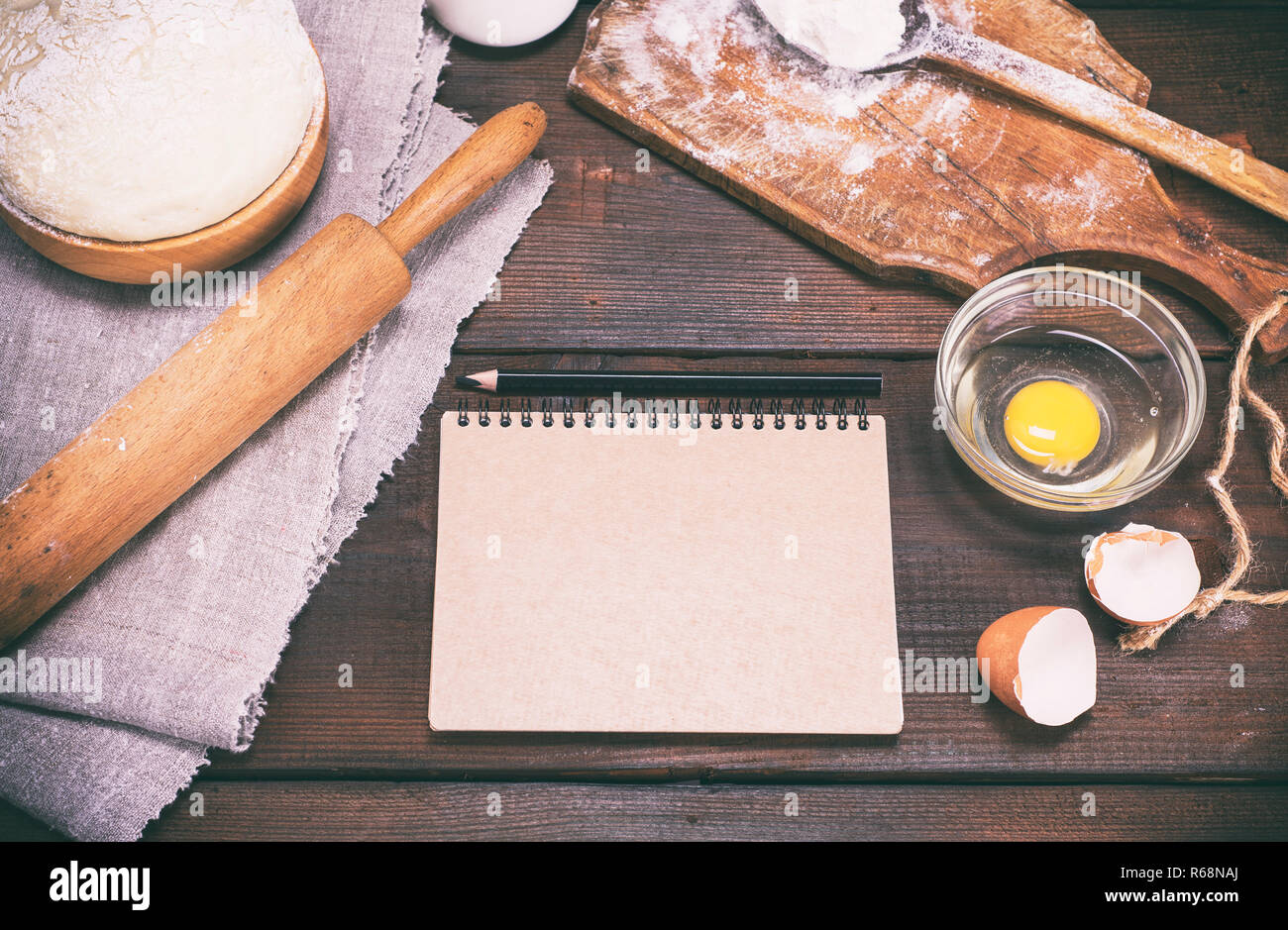 paper notepad with black pencil and dough with ingredients Stock Photo ...