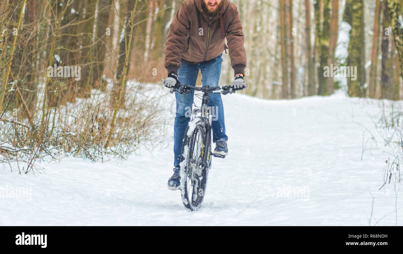 Person riding bike uphill hi-res stock photography and images - Alamy