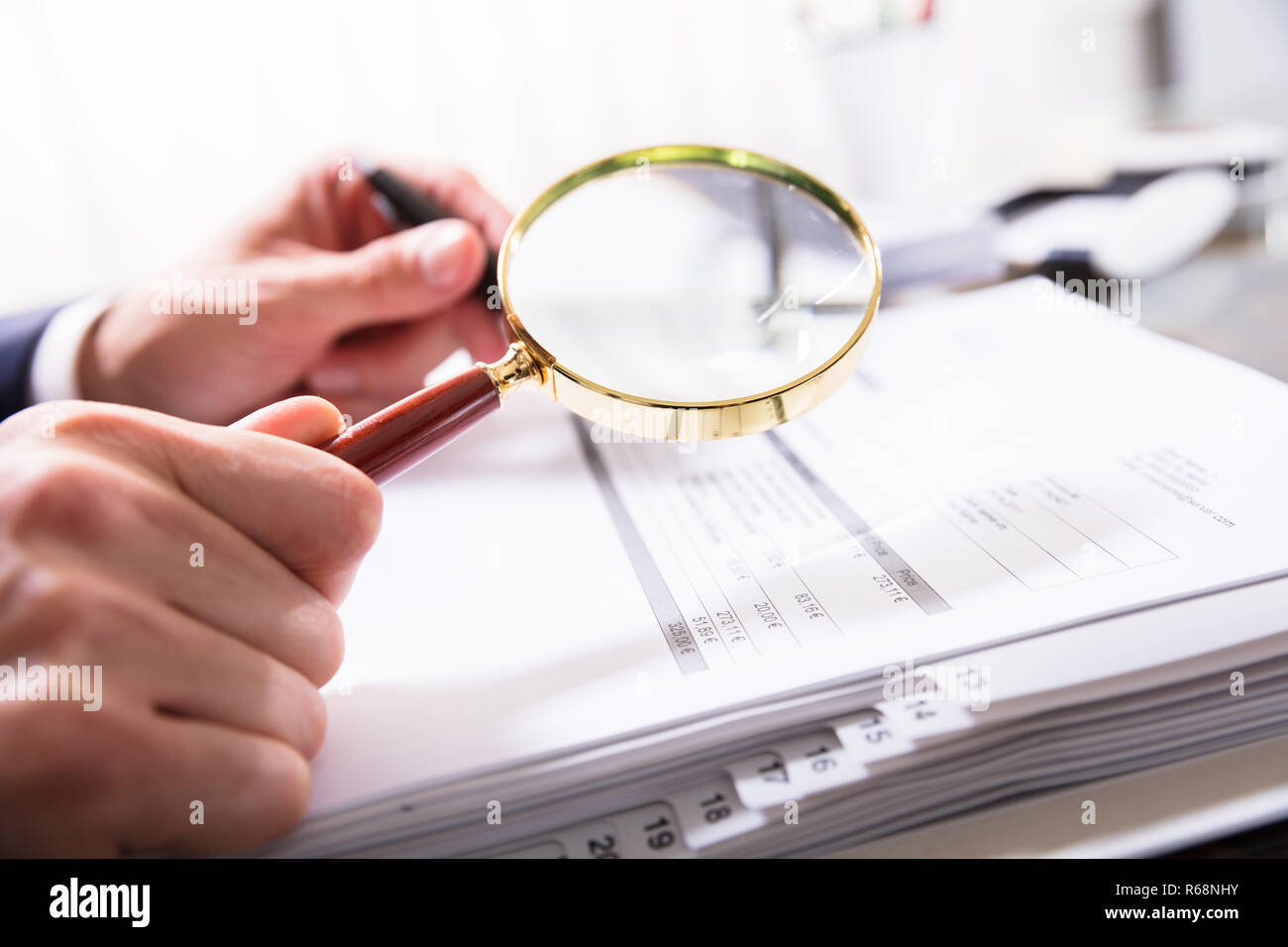 Businessperson Checking Bill With Magnifying Glass Stock Photo - Alamy