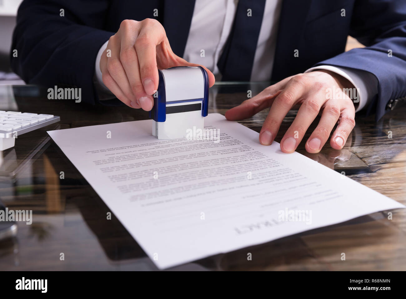 Businessperson stamping document hi-res stock photography and images ...