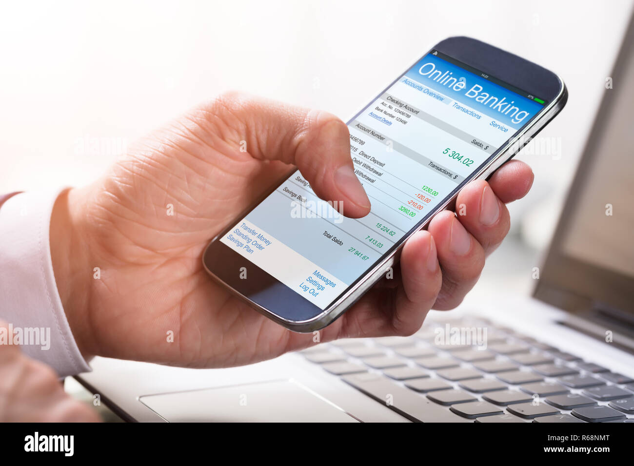 Businessperson Doing Online Banking On Smartphone Stock Photo - Alamy