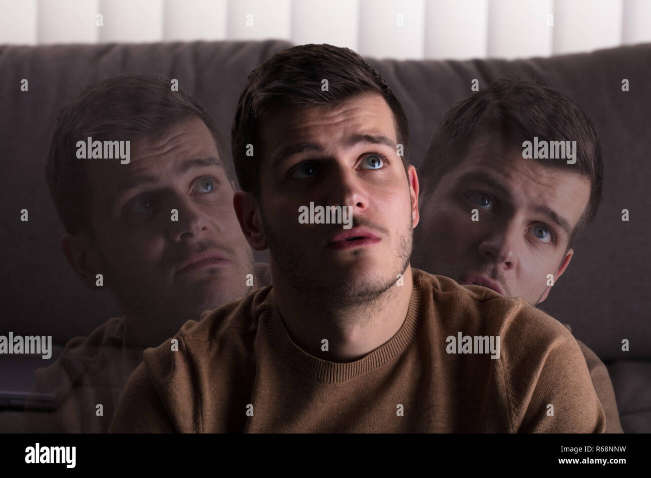 Contemplated Man At Home Stock Photo - Alamy