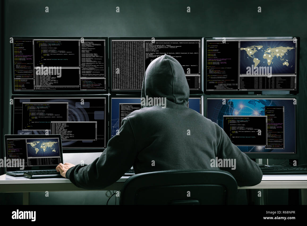 Hacker Using Multiple Computers For Stealing Data Stock Photo - Alamy