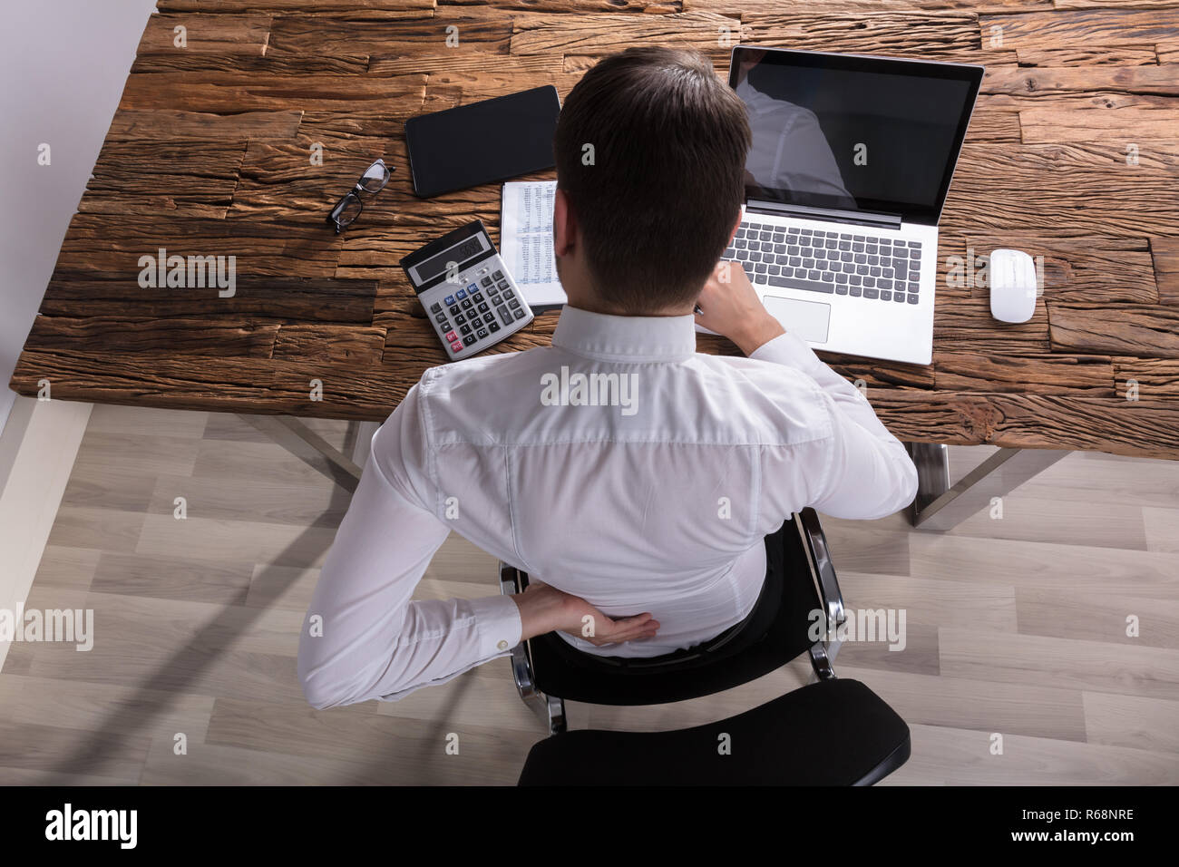 Businessman Suffering From Back Pain Stock Photo - Alamy