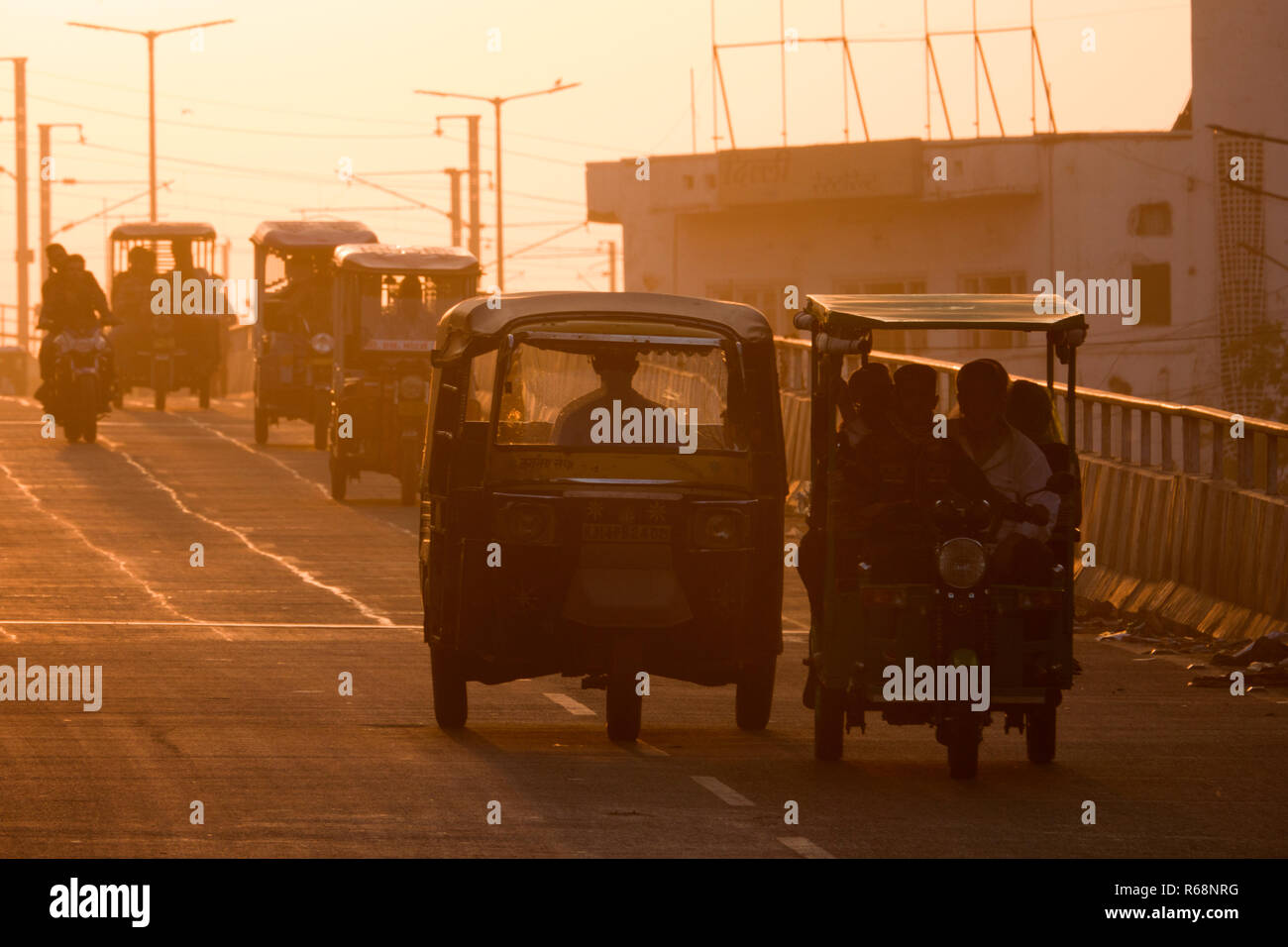 Auto rickshaws and traffic on overpass at sunset in Jaipur, Rajasthan ...