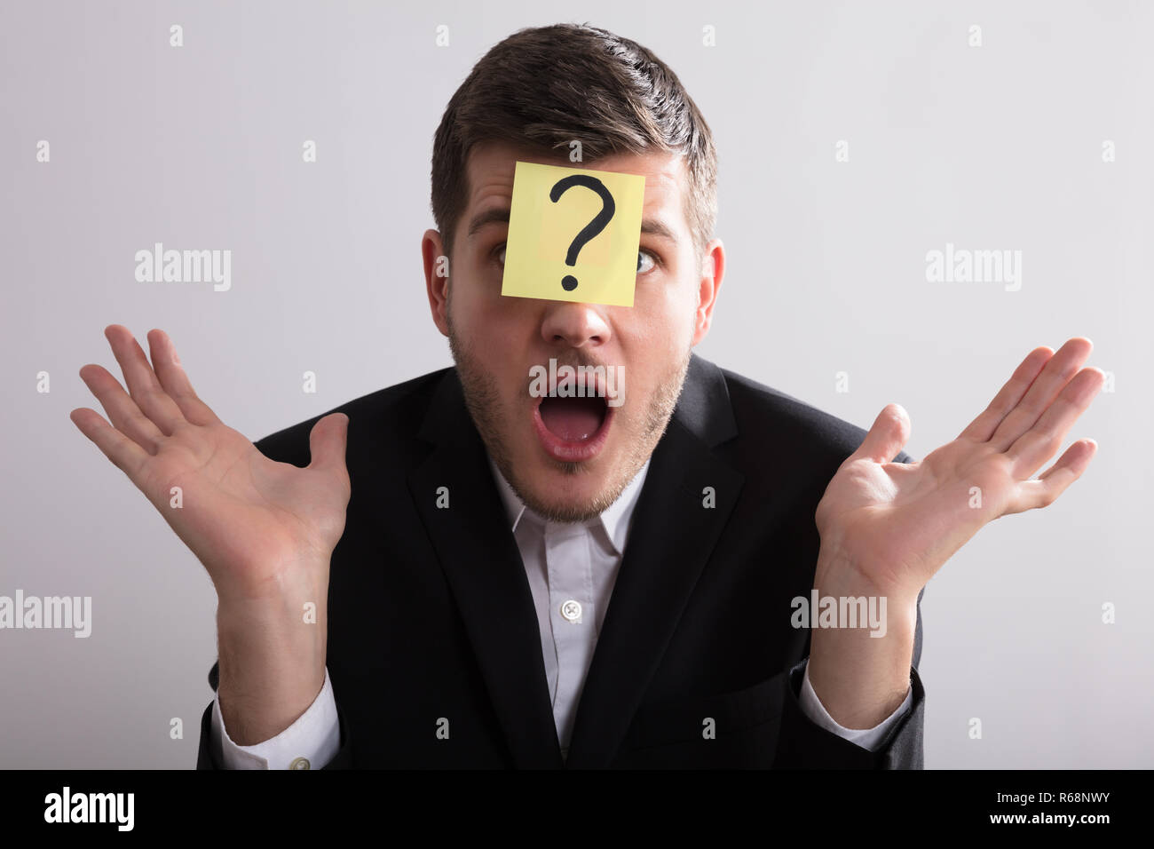 Businessman With Question Mark Sticky Note On His Forehead Stock Photo ...