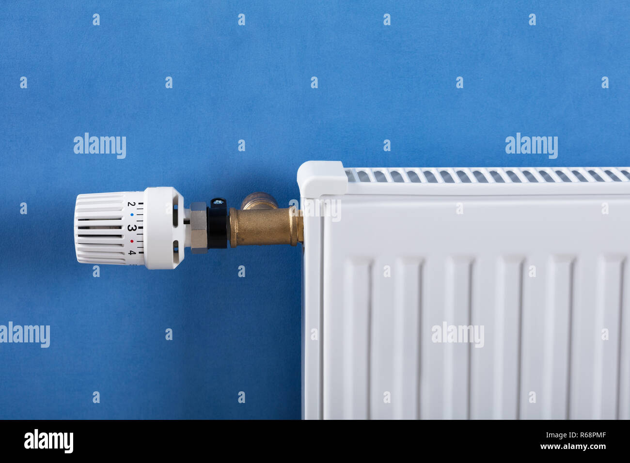 Radiator With Thermostat Stock Photo - Alamy