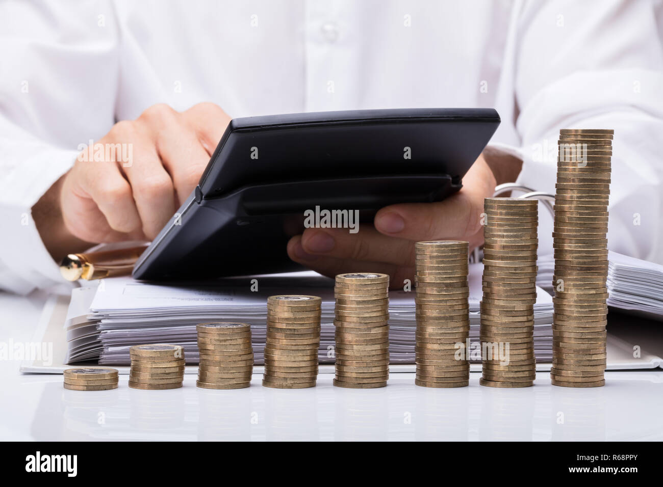 Businessman Calculating Bill With Calculator Stock Photo - Alamy