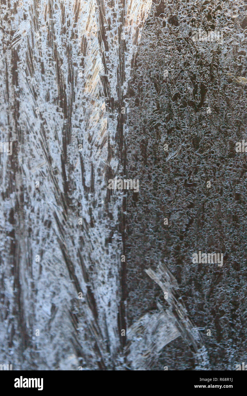 Painted developed frosty patterns on the winter ice window Stock Photo ...