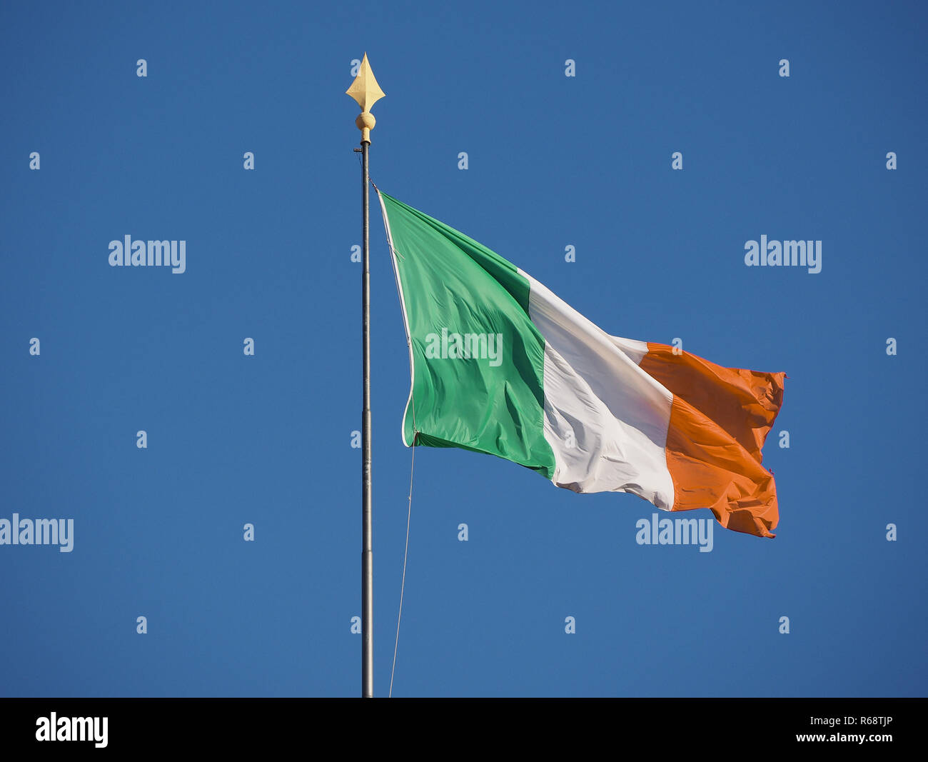 Irish Flag of Ireland over blue sky Stock Photo - Alamy