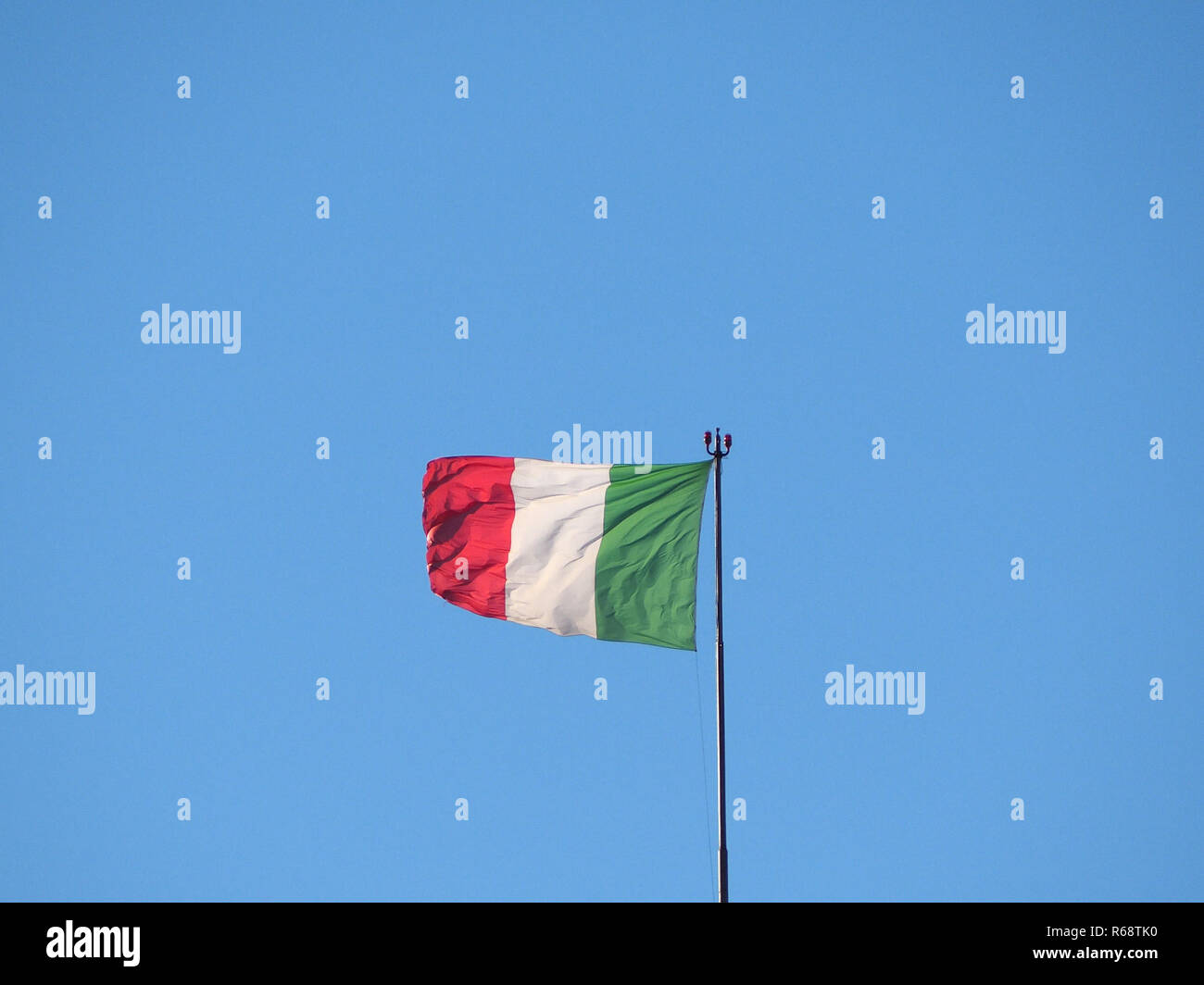 Italian Flag of Italy over blue sky Stock Photo - Alamy
