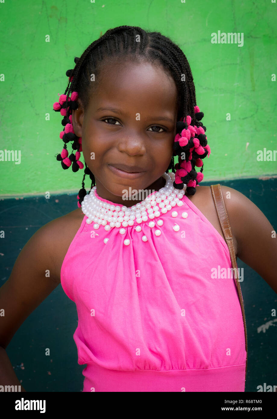 Portrait of a Angolan teenager girl dressed for the church service ...