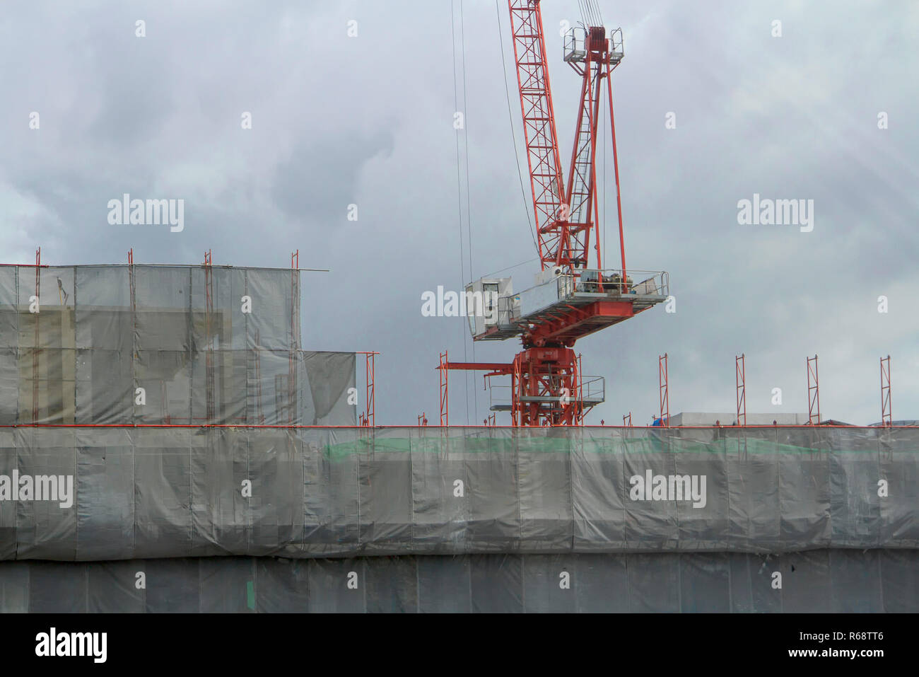 Red crane is under construction Stock Photo - Alamy
