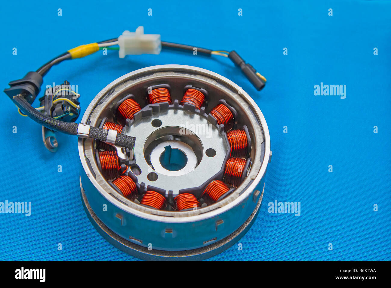 Kit magneto flywheel stator on a blue background Stock Photo - Alamy