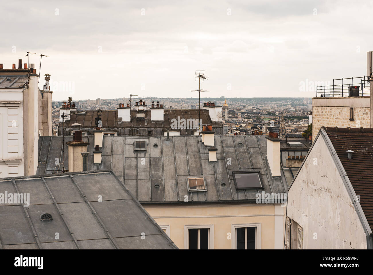 Roofs of Paris, grey sky Stock Photo - Alamy