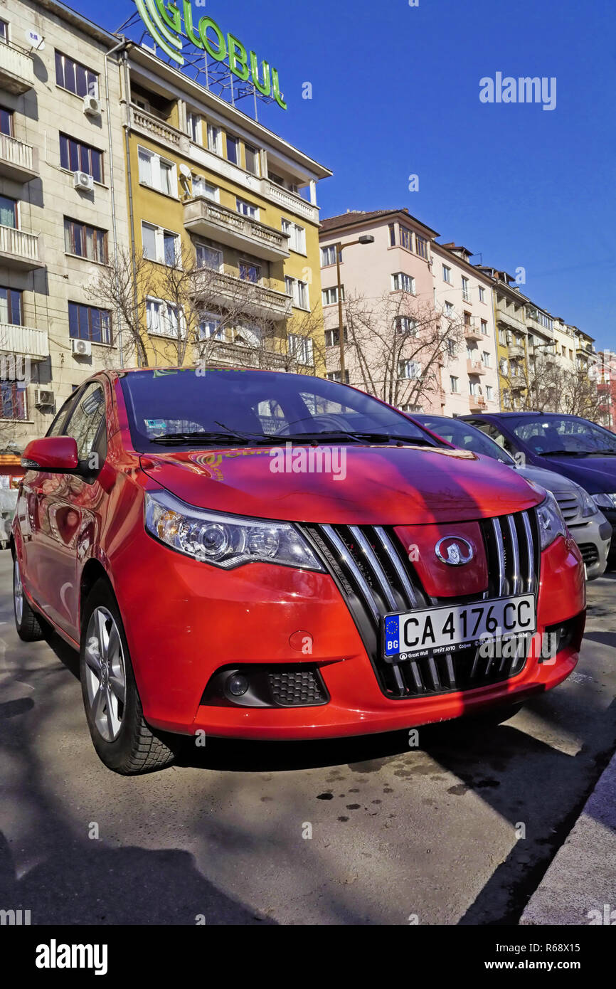 A modern red Chinese car parked on a street in Sofia, the capital of ...