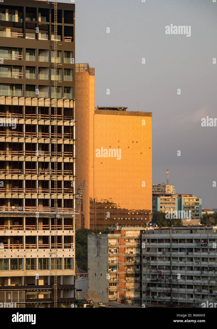 Buildings along the Marginal promenade in Luanda city center at sunset ...