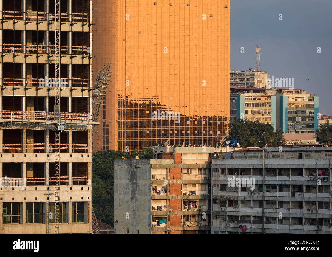 Buildings along the Marginal promenade in Luanda city center at sunset ...