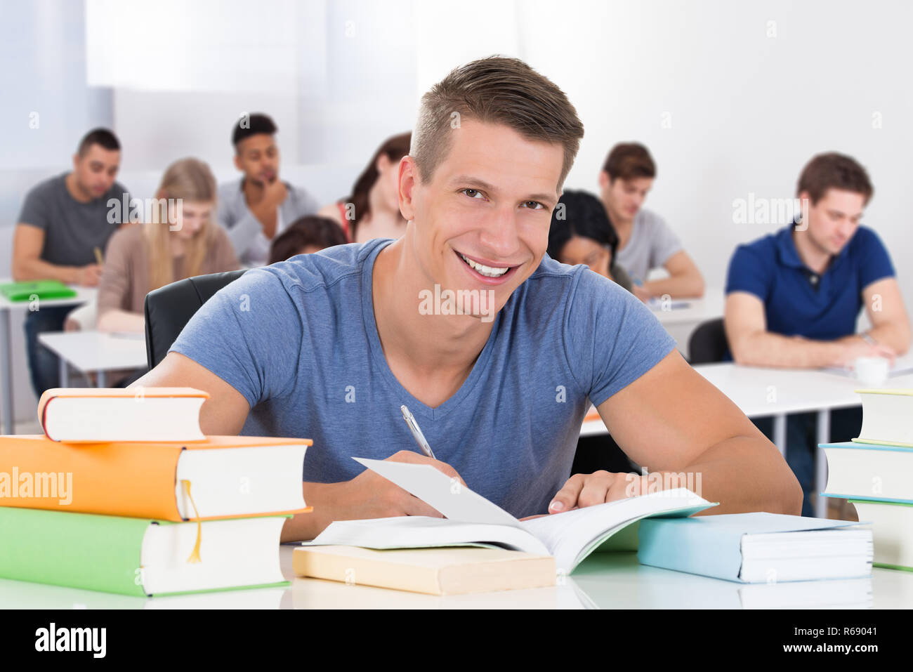 Portrait Of A Happy Male Student Stock Photo - Alamy