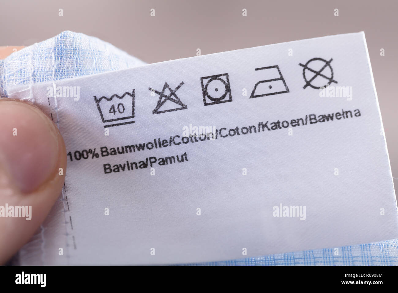 Person Reading Clothing Label Stock Photo - Alamy