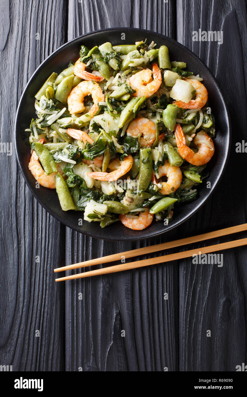 Delicious peeled king prawns with a refreshing mix of pak choi, spinach ...
