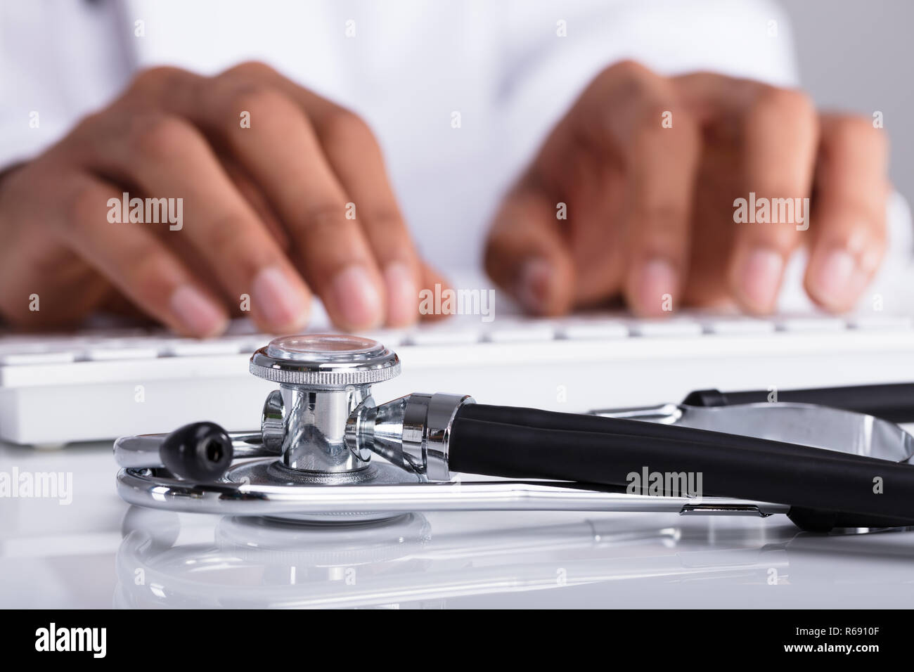 Doctor Typing On Computer Keyboard Stock Photo - Alamy
