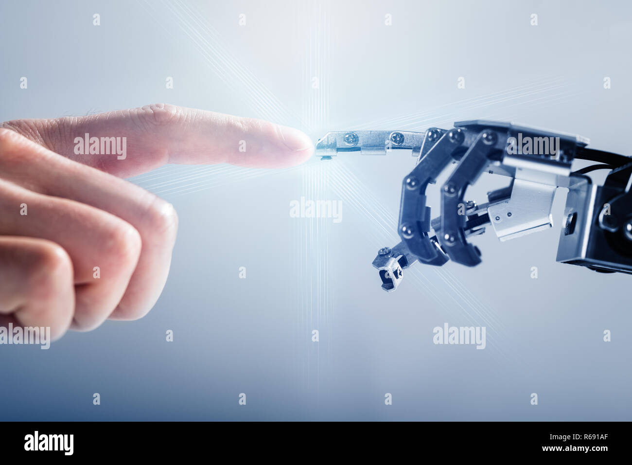 Businessperson's Finger Touching Robotic Finger Stock Photo - Alamy