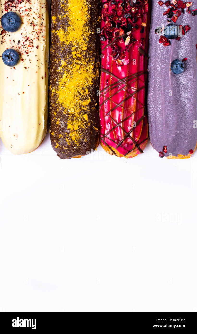colorful eclairs background isolated on white, copy space Stock Photo ...