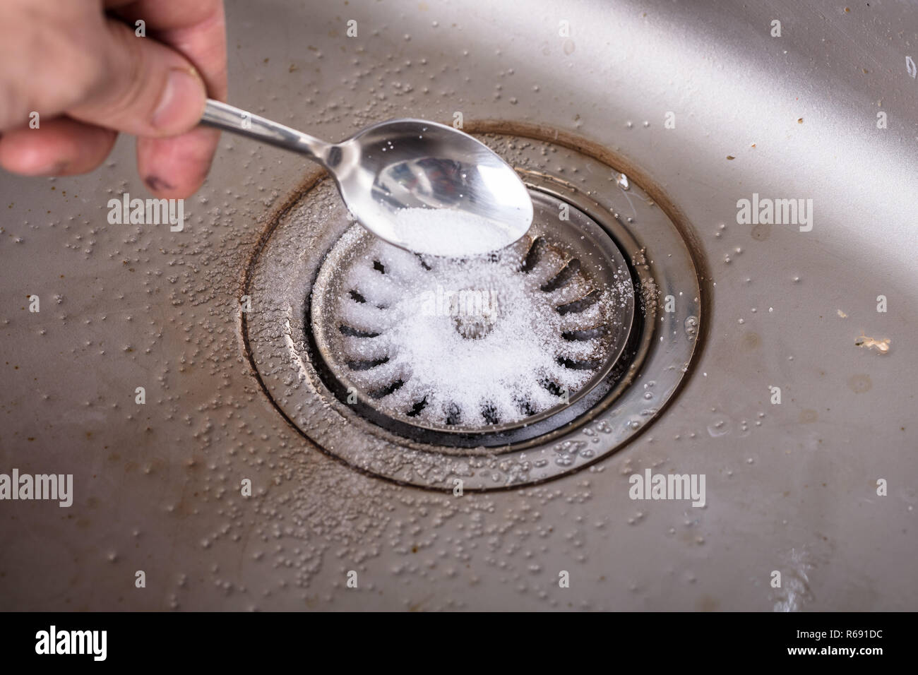 Person Cleaning The Washbasin Drain Stock Photo - Alamy