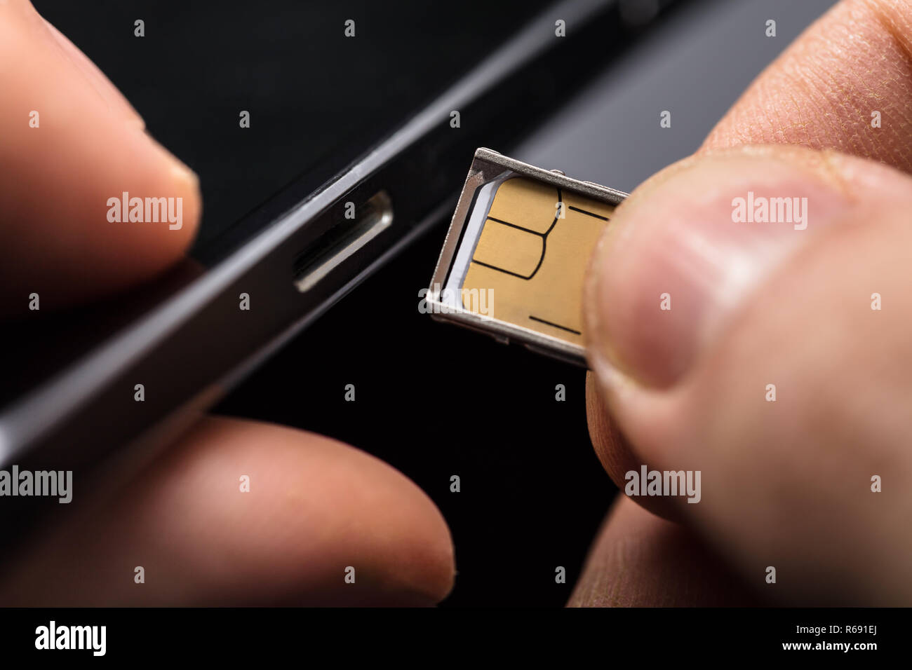 Inserting a sim card hi-res stock photography and images - Alamy