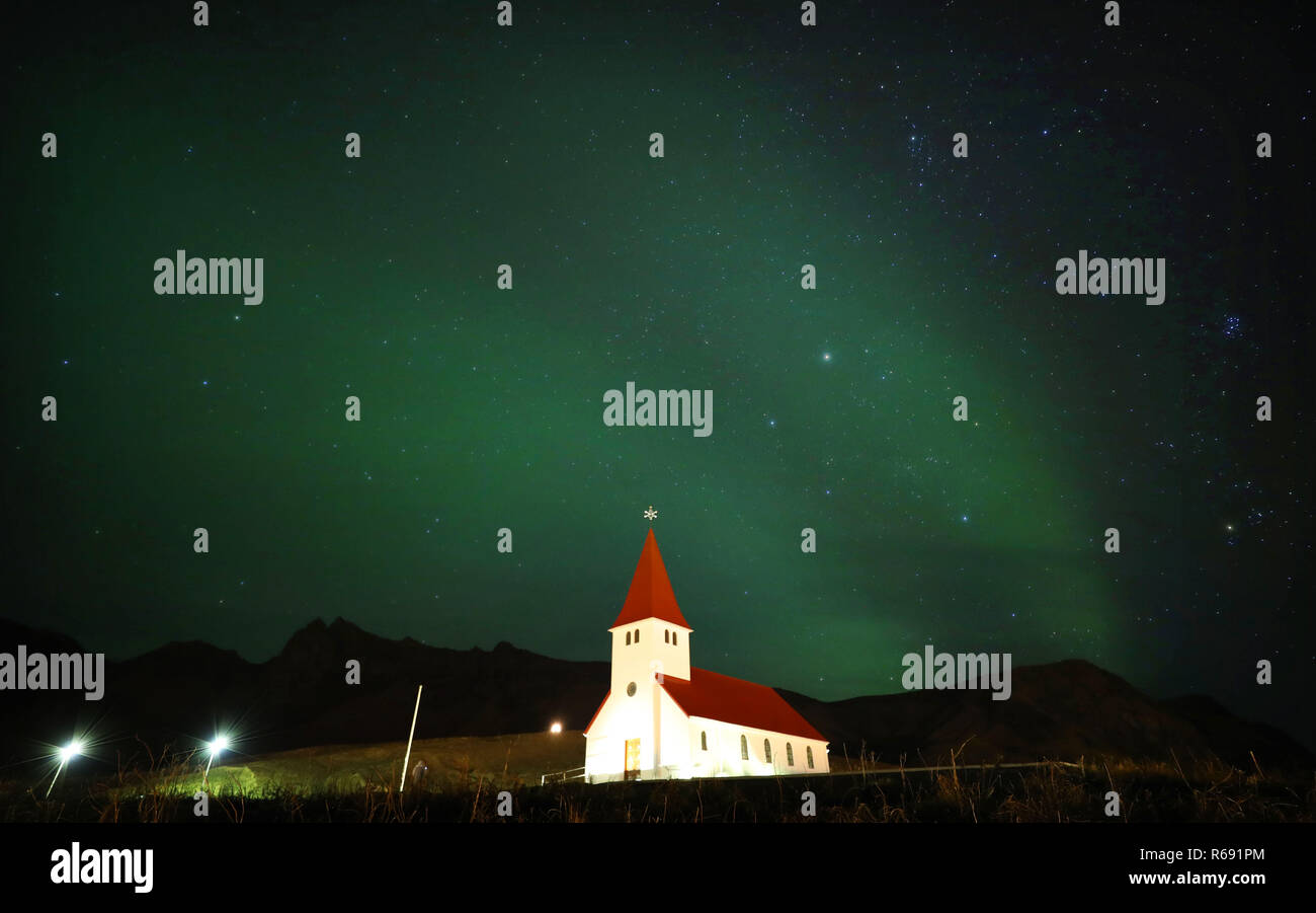 The Northern Lights over the Reyniskirkja Church in Vik, Iceland Stock ...