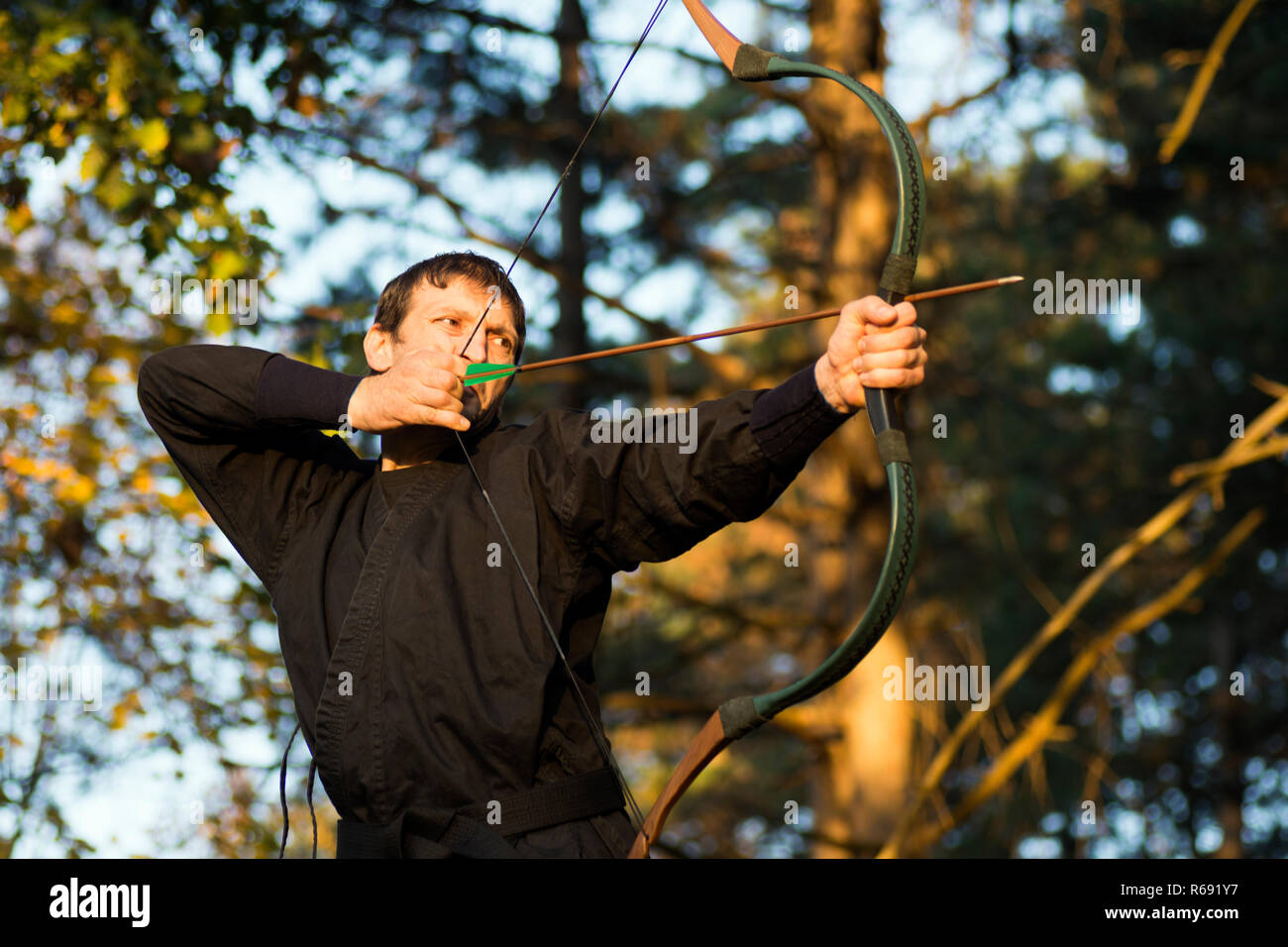 archer with bow and arrow Stock Photo - Alamy