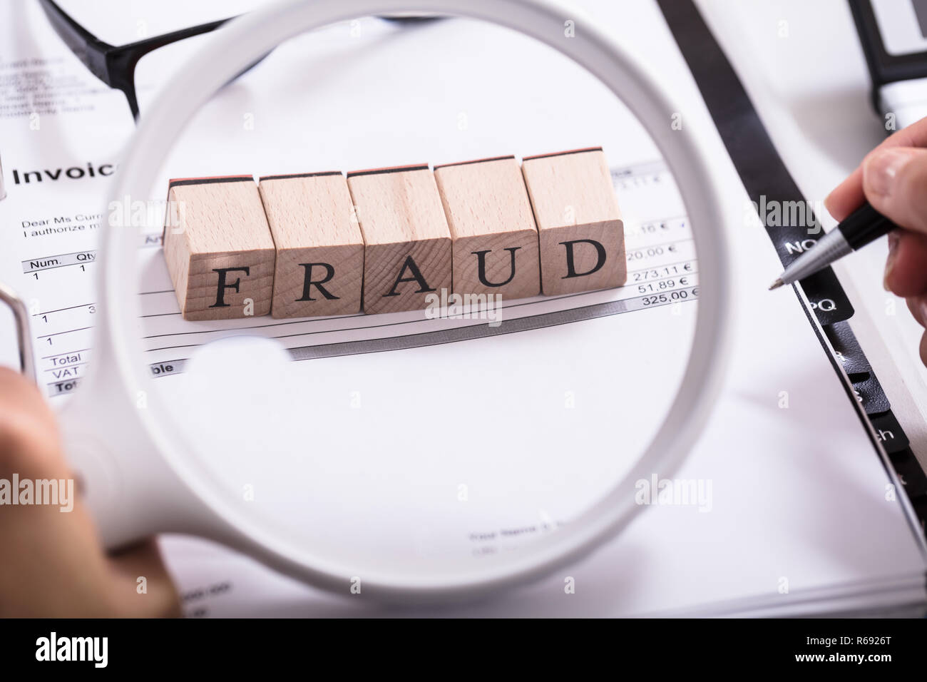 Person Holding Magnifying Glass And Examining Fraud Blocks Stock Photo ...