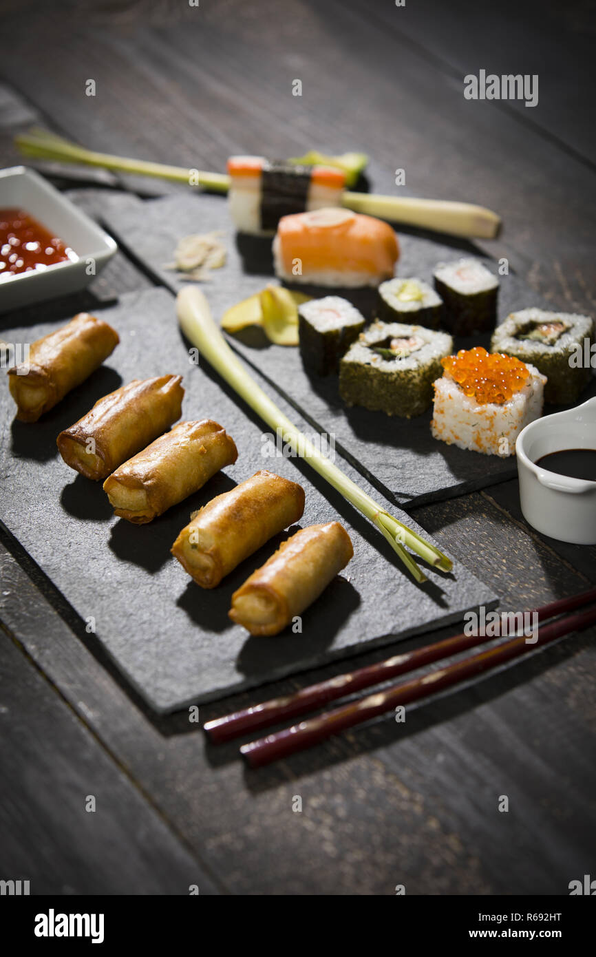 Spring Rolls And Sushi Stock Photo - Alamy