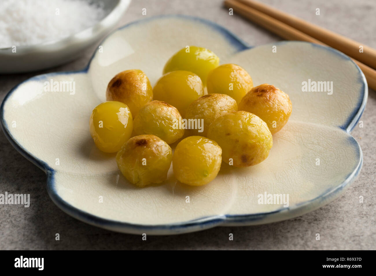 Roasted ginkgo biloba nuts close up on a dish as a snack Stock Photo ...