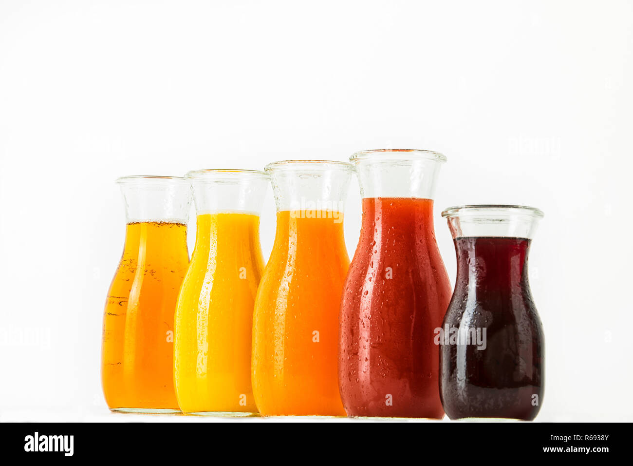 Fruit Juices In Juice Bottles Stock Photo - Alamy