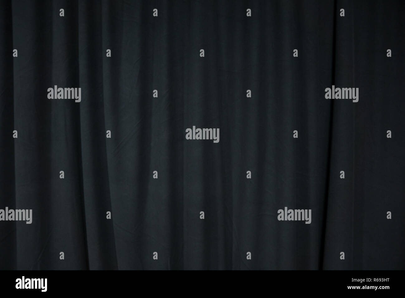 Black stage curtain with spotlight Stock Photo - Alamy