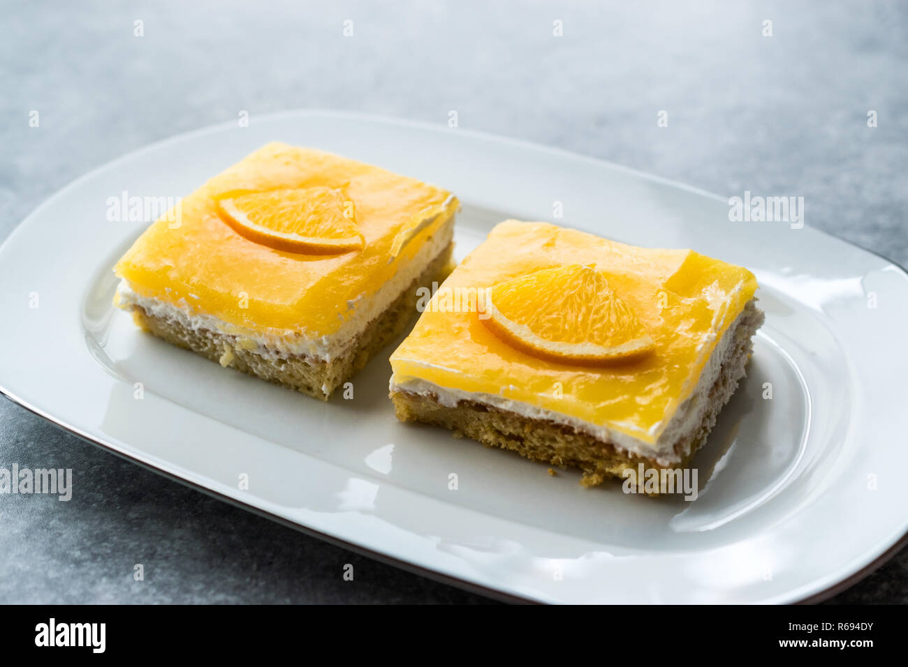 Square Slice of Orange Mascarpone Quark Cake. Dessert Concept Stock ...