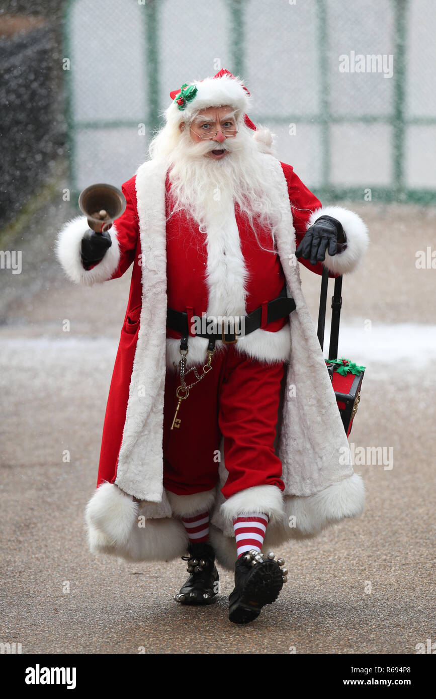 A man dressed as Father Christmas arrives at Kensington Palace, London ...