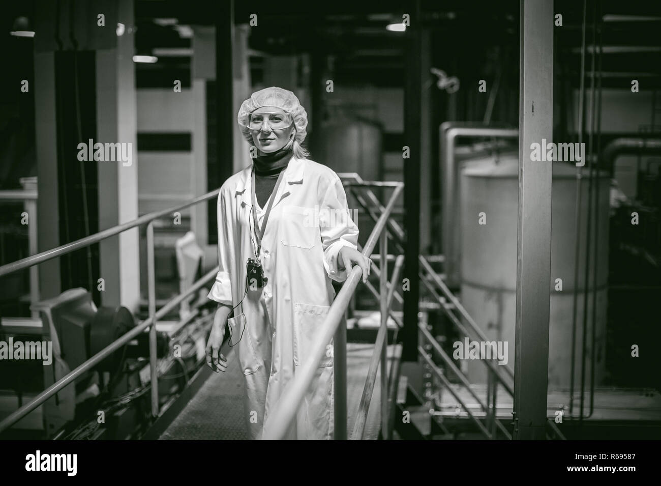 Factory employee observing working process hi-res stock photography and ...
