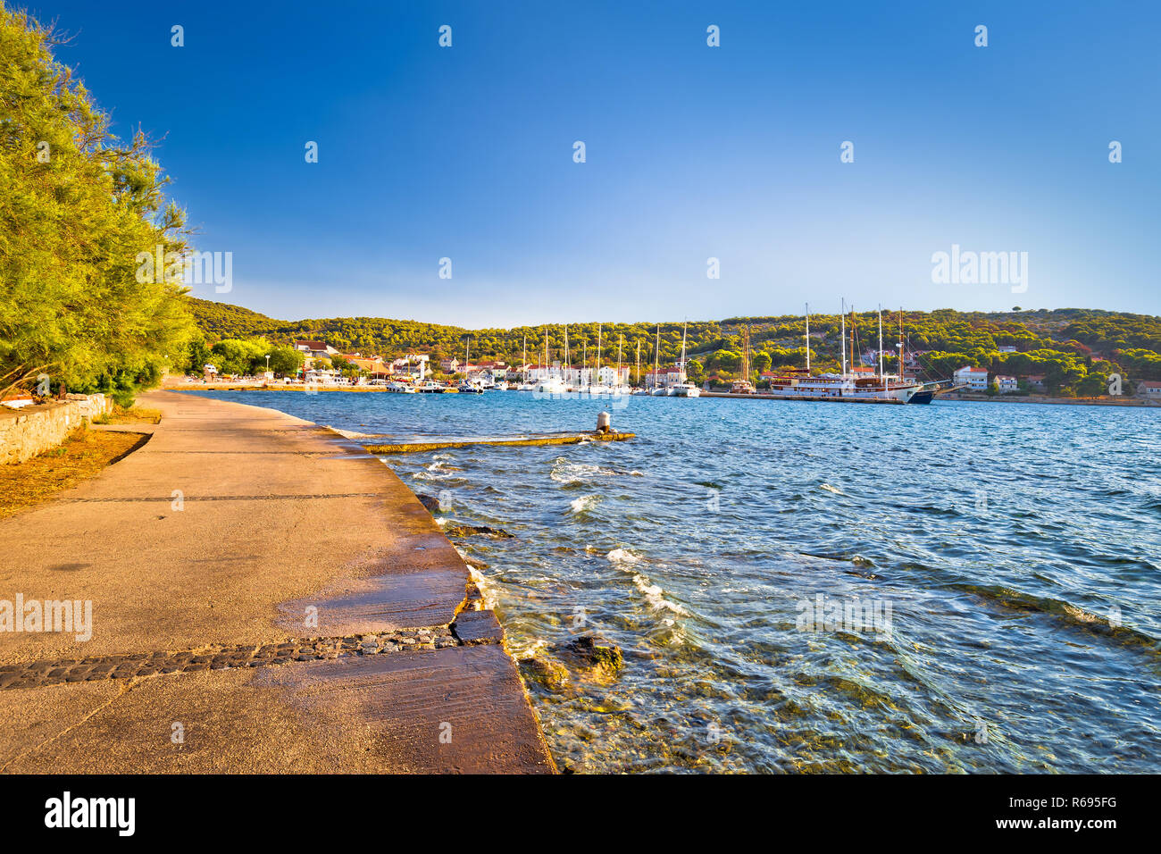 Seafront walkway on island of Zlarin Stock Photo - Alamy